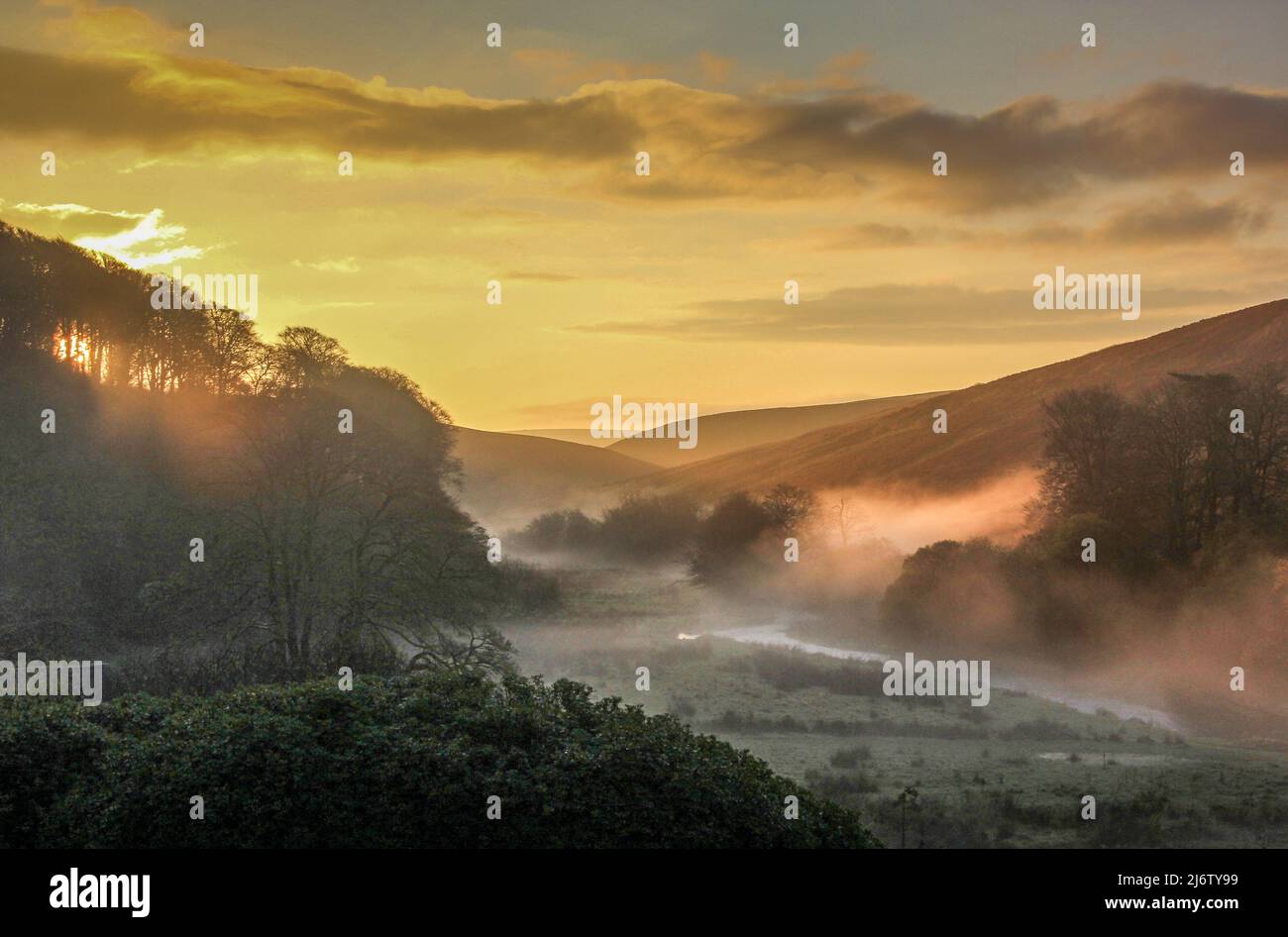 This is the view of sunrise in the Barle Valley at Simonsbath on Exmoor ...
