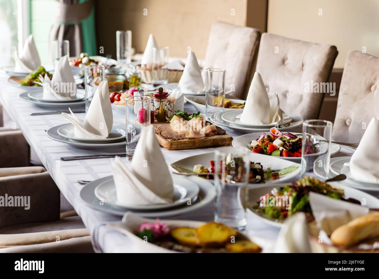Different salads served at the celebratory table Stock Photo - Alamy