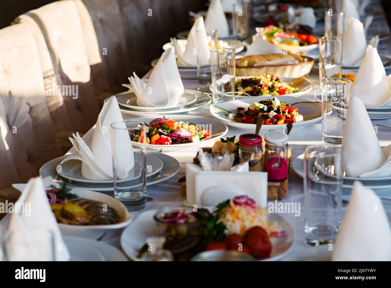 Different salads served at the celebratory table Stock Photo - Alamy