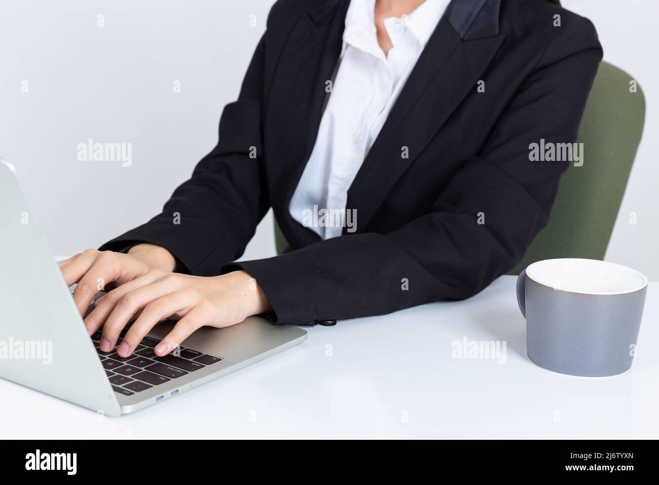 business woman sit at desk in office Stock Photo - Alamy