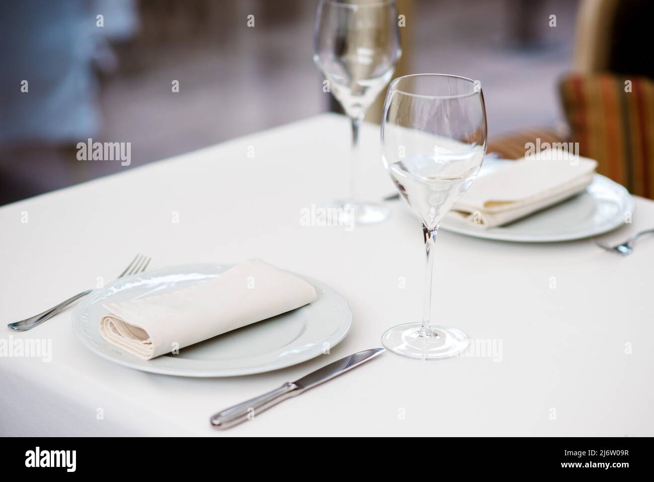 Beautiful table setting, with glasses and utensils Stock Photo - Alamy