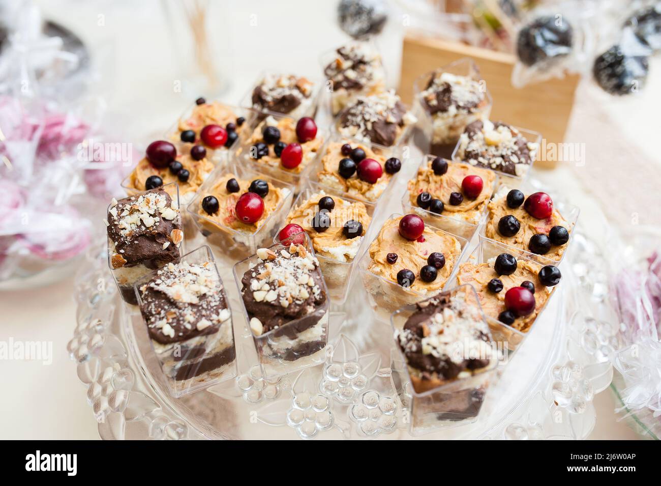 Multi-colored cakes and sweets on the festive table Stock Photo - Alamy