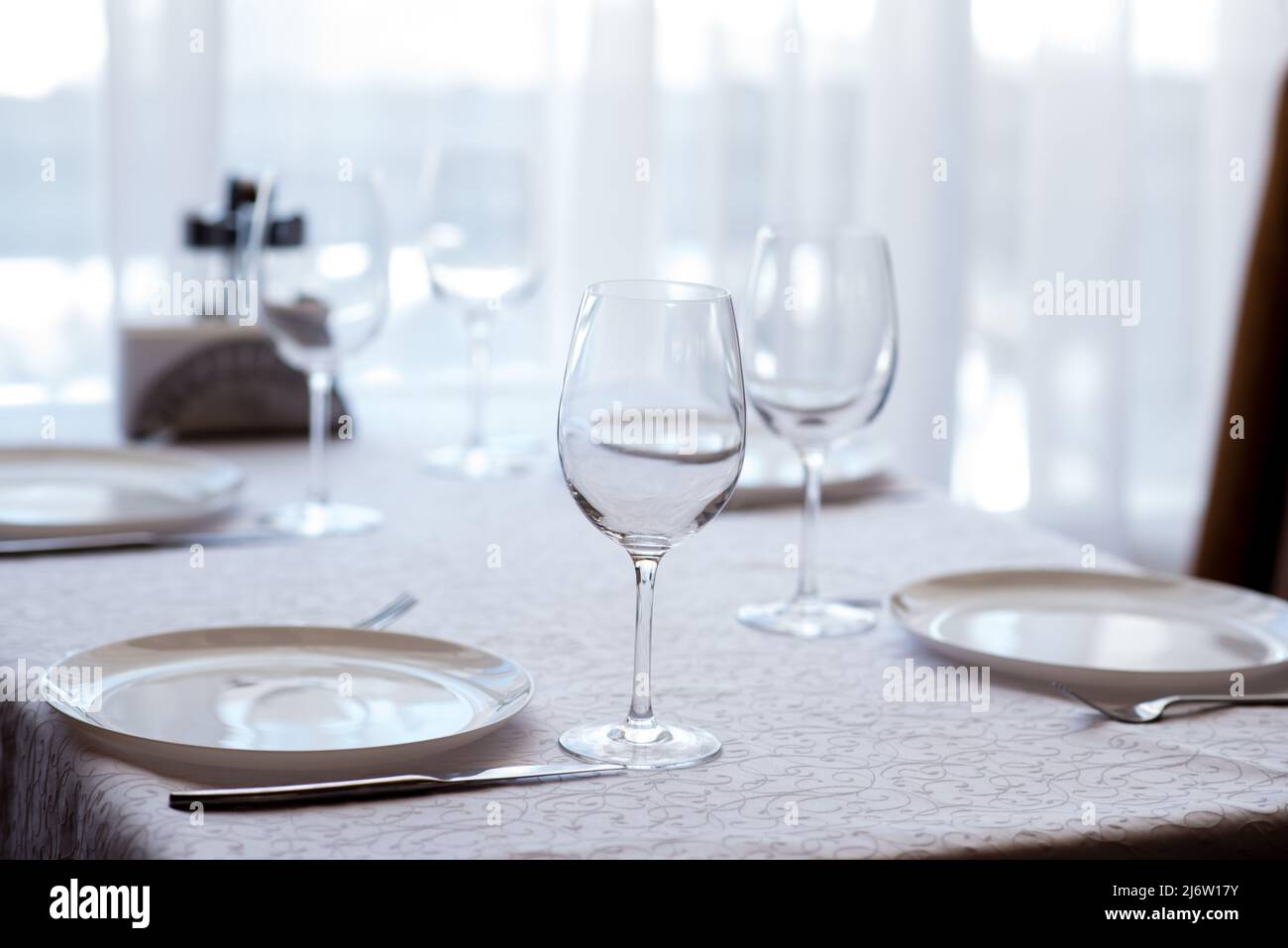 Classic table in the restaurant Stock Photo - Alamy