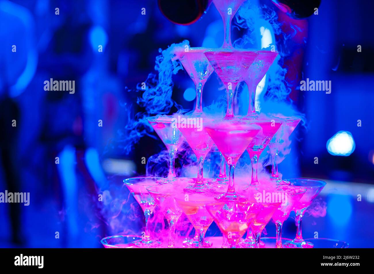 a pyramid of champagne glasses at a festive event Stock Photo - Alamy
