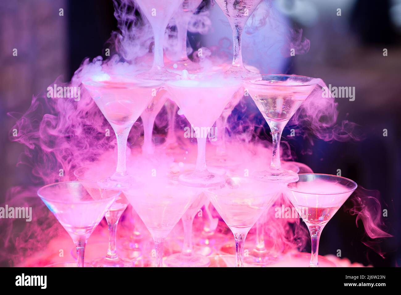 a pyramid of champagne glasses at a festive event Stock Photo - Alamy