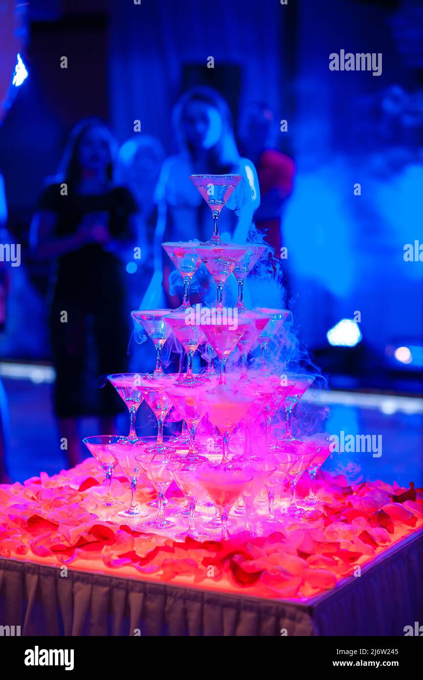 a pyramid of champagne glasses at a festive event Stock Photo - Alamy