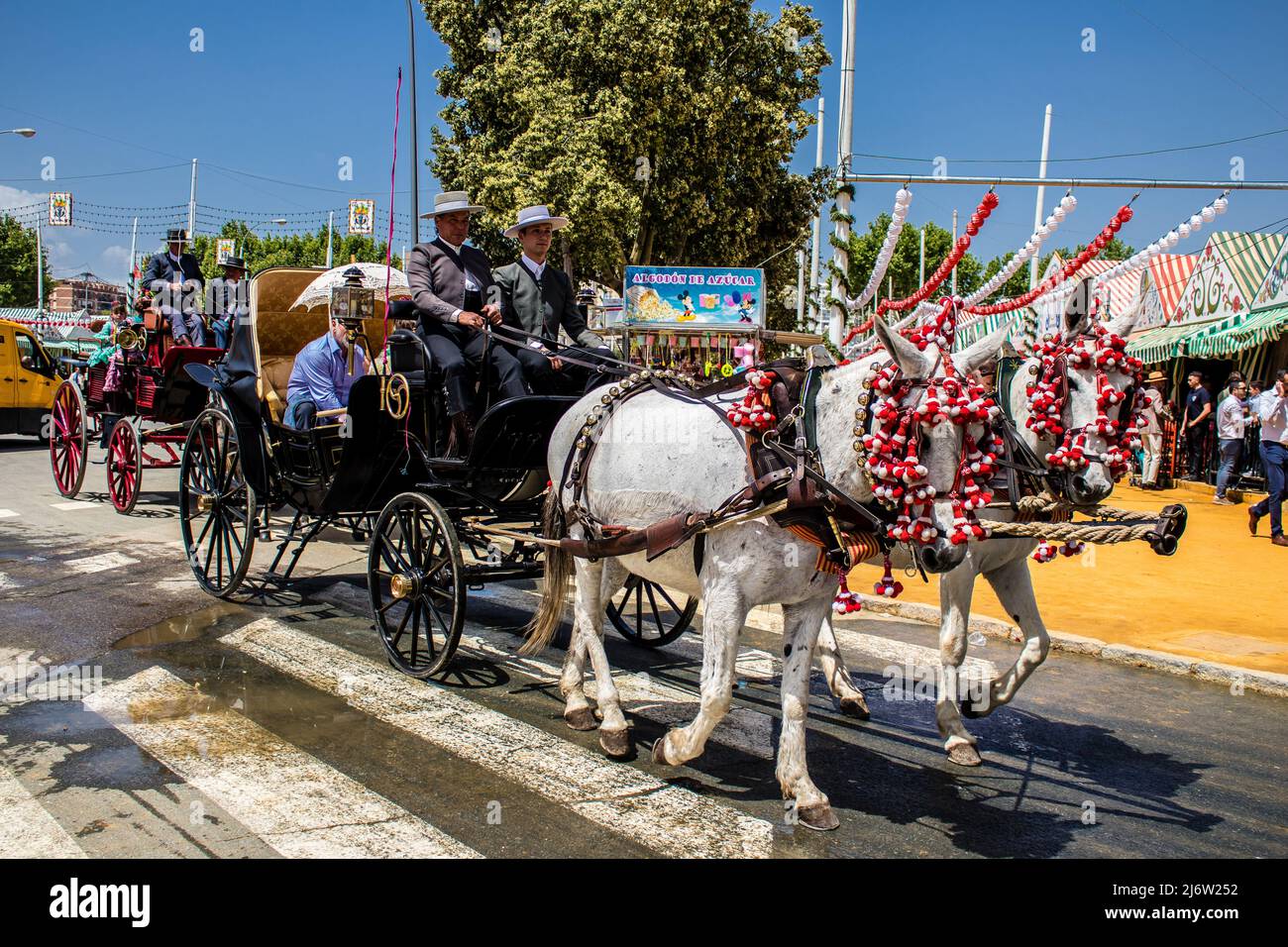 Seville, Spain - May 01, 2022 Sevillians dressed in the traditional ...