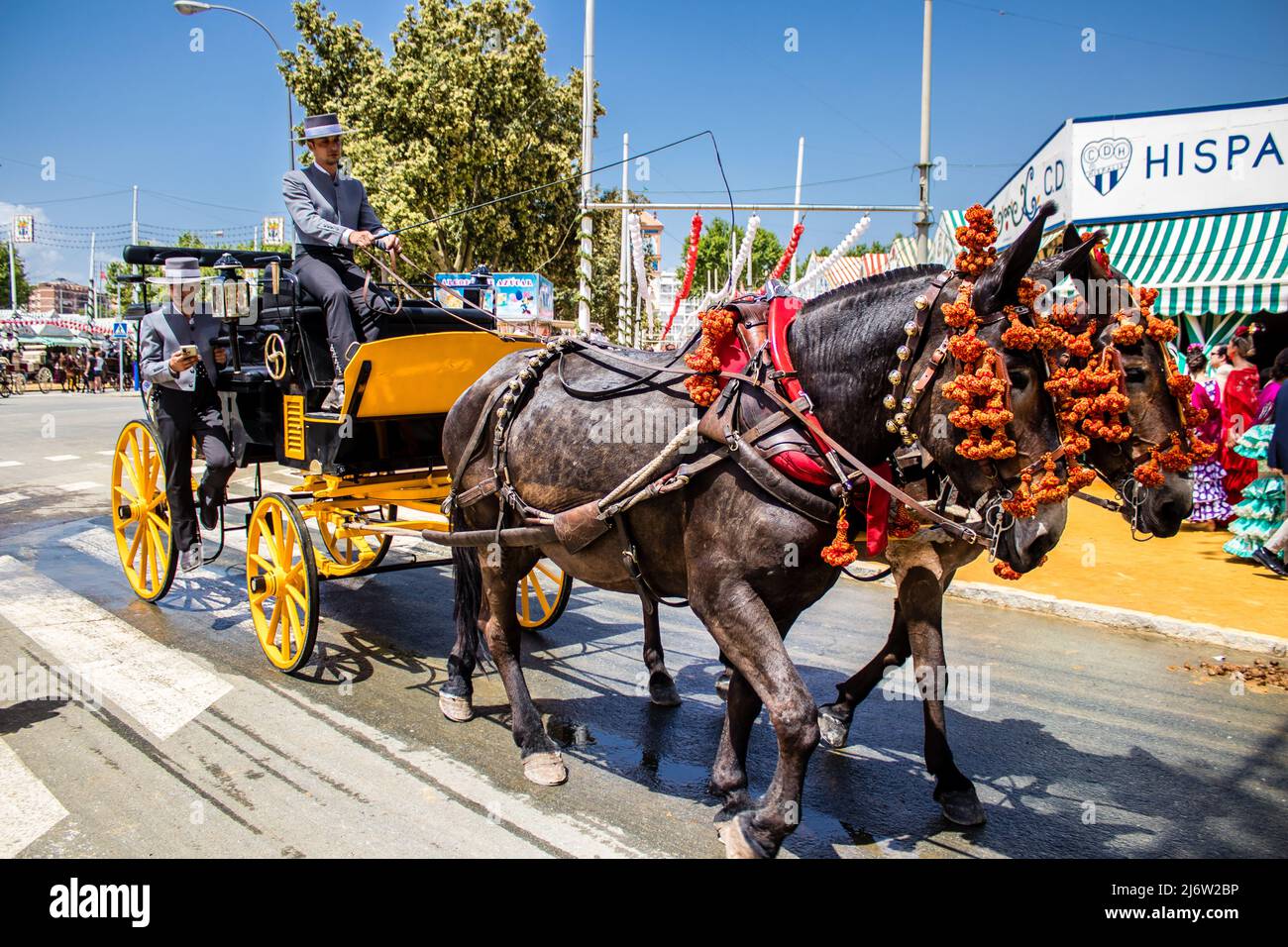 Seville, Spain - May 01, 2022 Sevillians dressed in the traditional ...