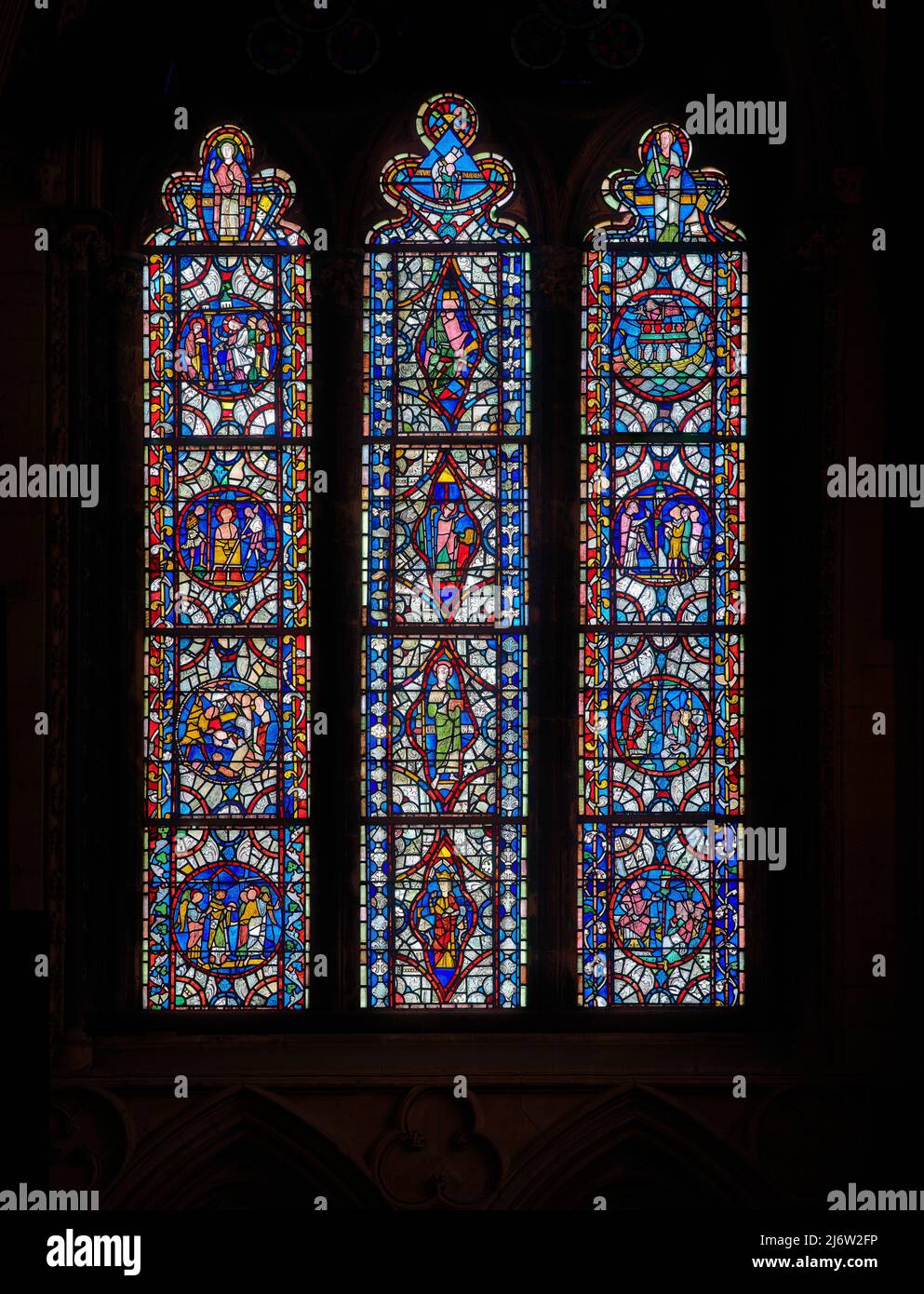 Triptych of medieval stained glass windows in Lincoln cathedral ...