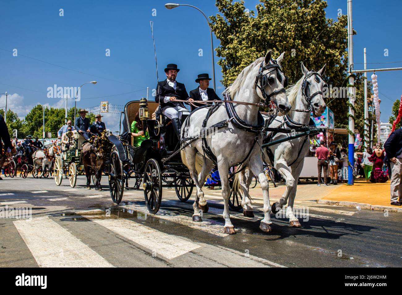 Seville, Spain - May 01, 2022 Sevillians dressed in the traditional ...