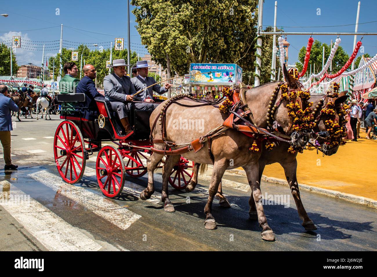 Seville, Spain - May 01, 2022 Sevillians dressed in the traditional ...