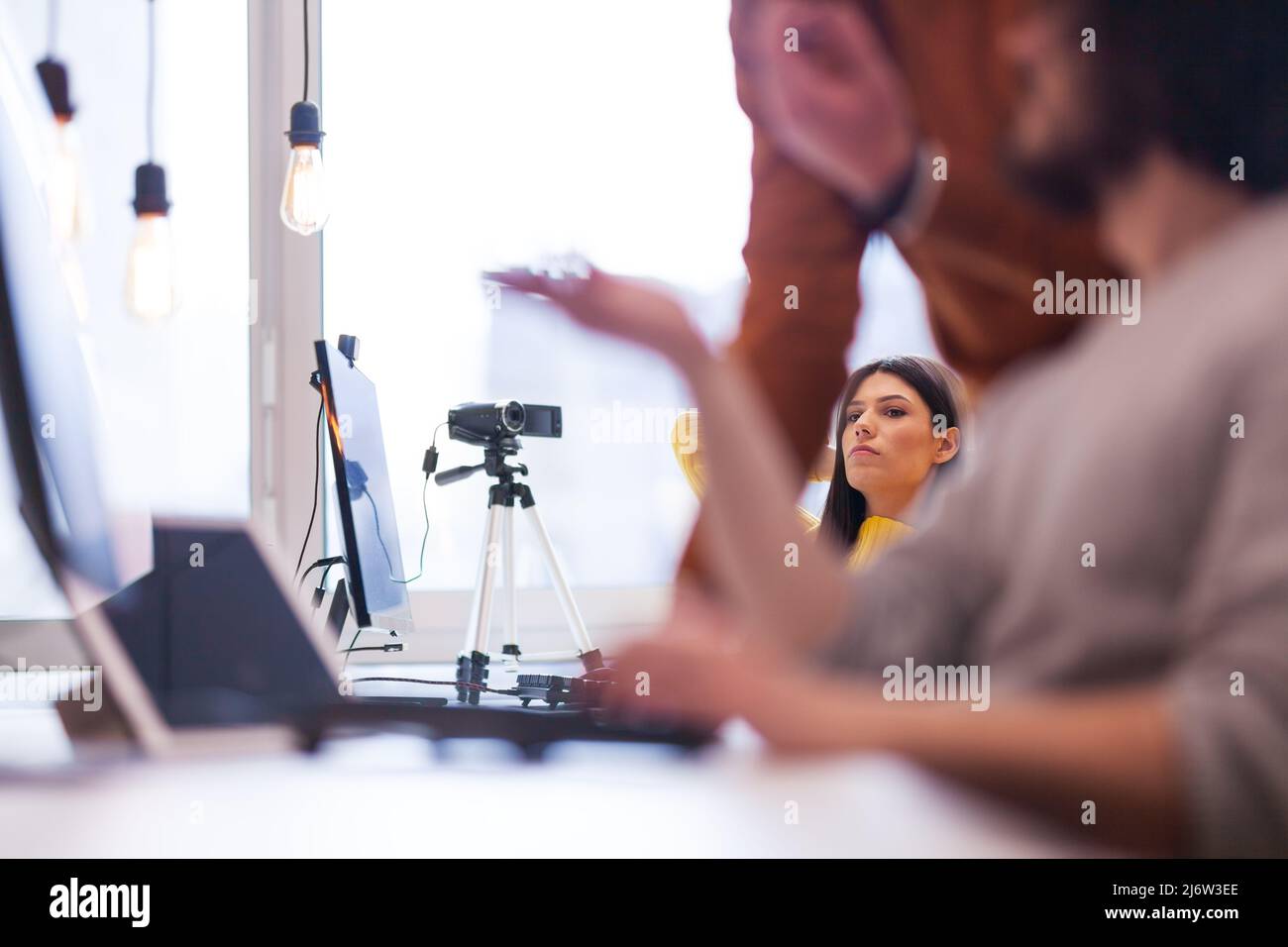 Business people having conversation in modern coworking office space ...