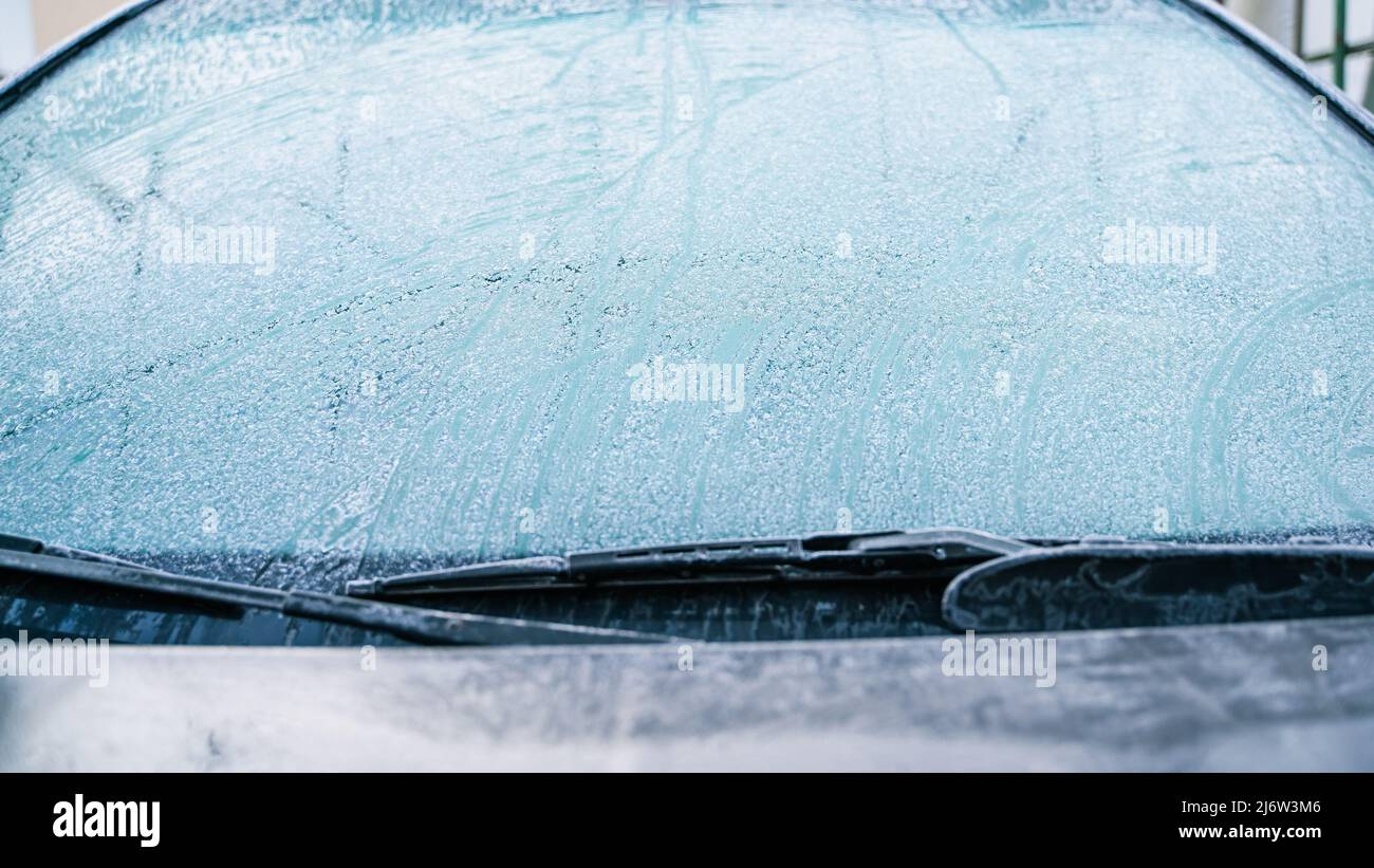 The windshield of the car was covered with frost, outside view Stock ...