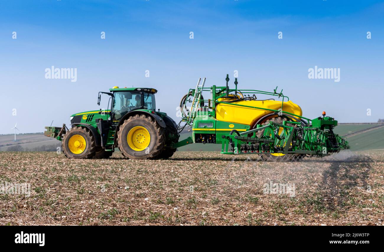 Spraying arable crop on the Yorkshire Wolds near York, using a John ...
