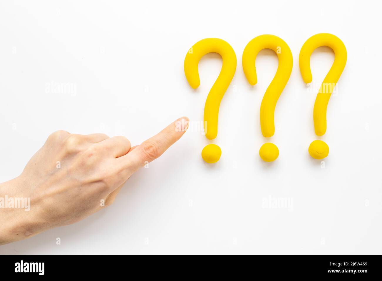Hand with question mark symbol. FAQ and help concept Stock Photo - Alamy