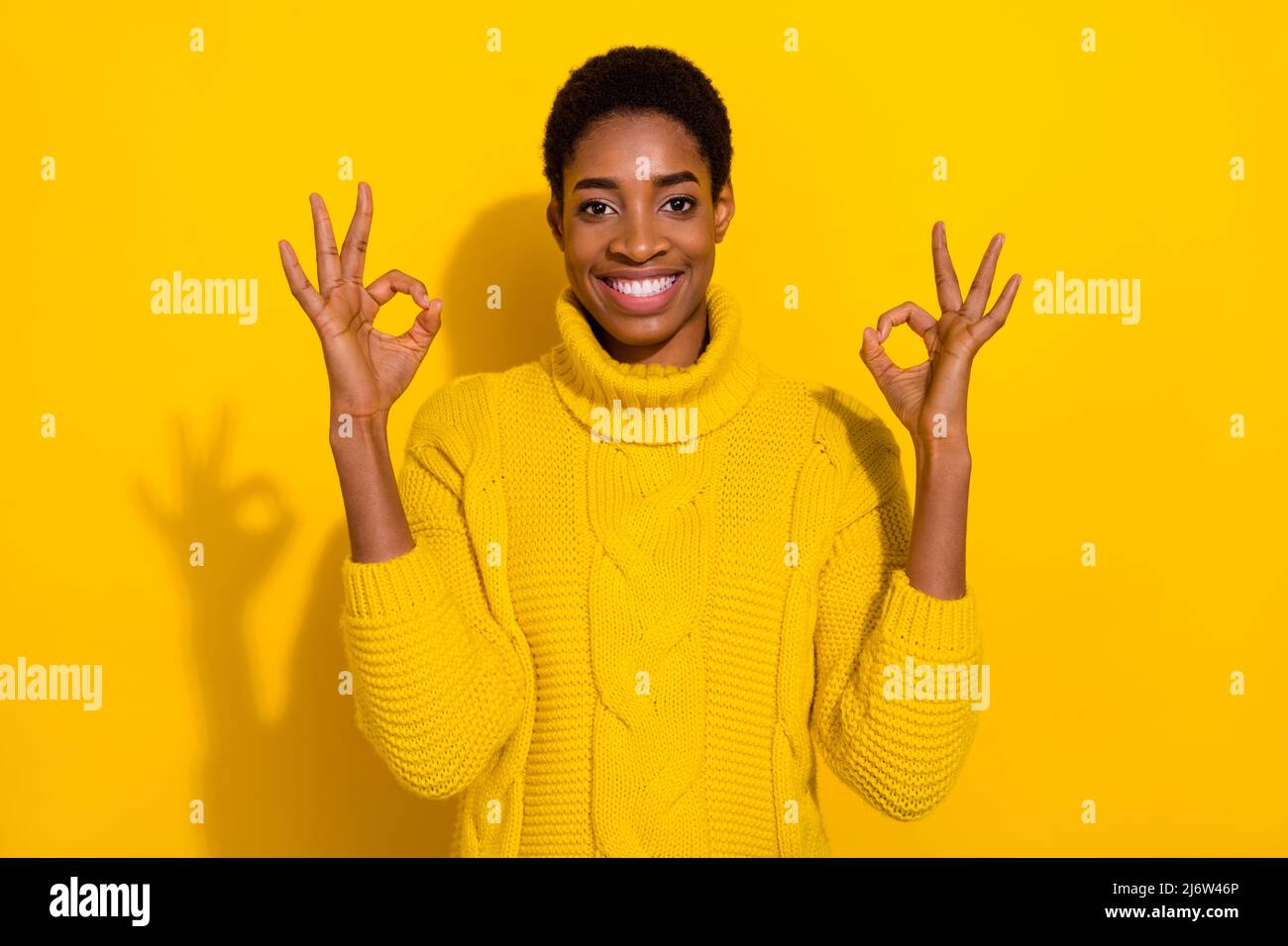 Portrait of charming positive trans male show double okay gesture ...