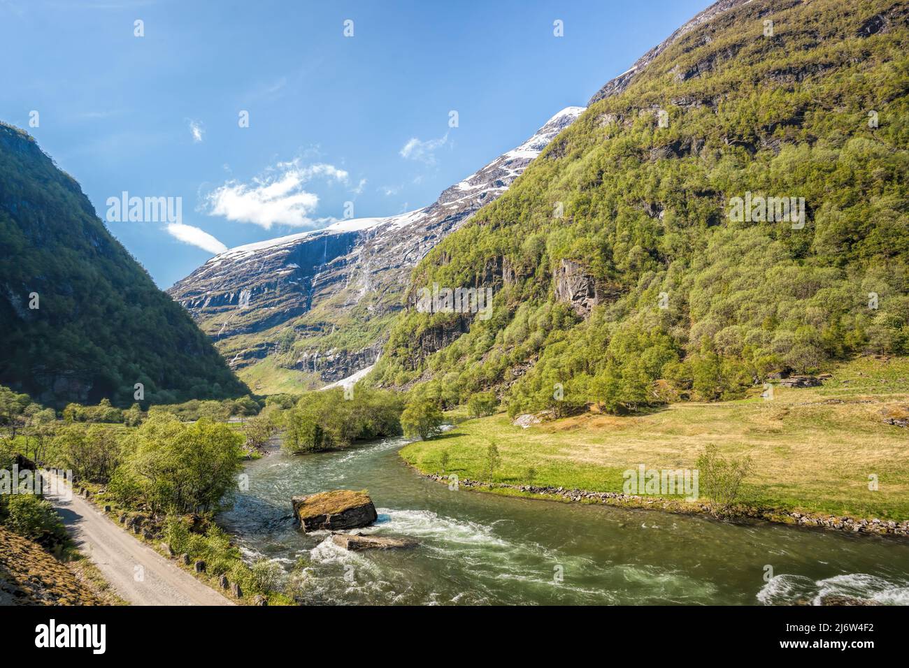Deep valley with river of Norwegian fjords close the train journey Flamsbana between Flam and ...