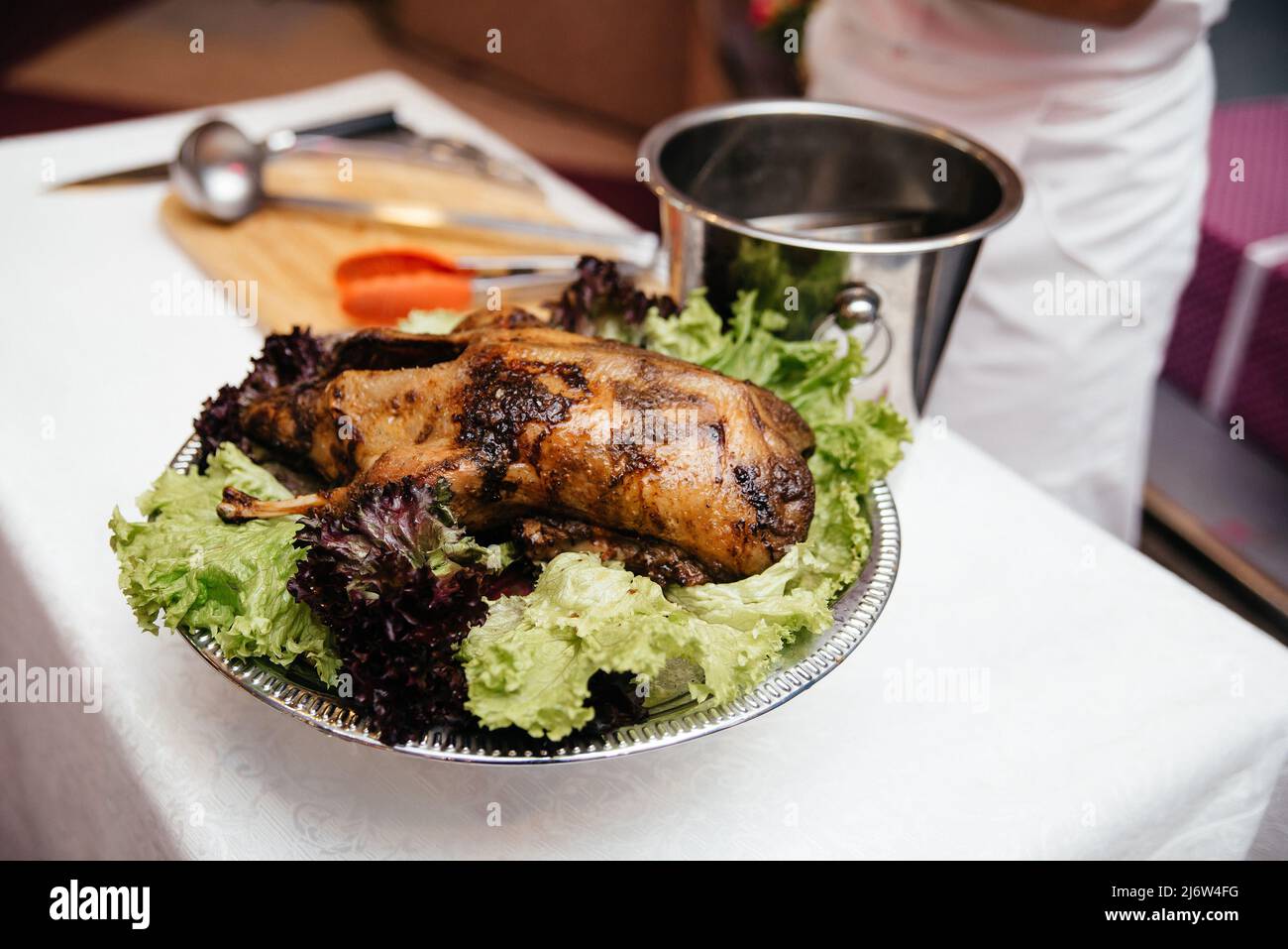 Baked duck on a platter with vegetables and salad Stock Photo - Alamy