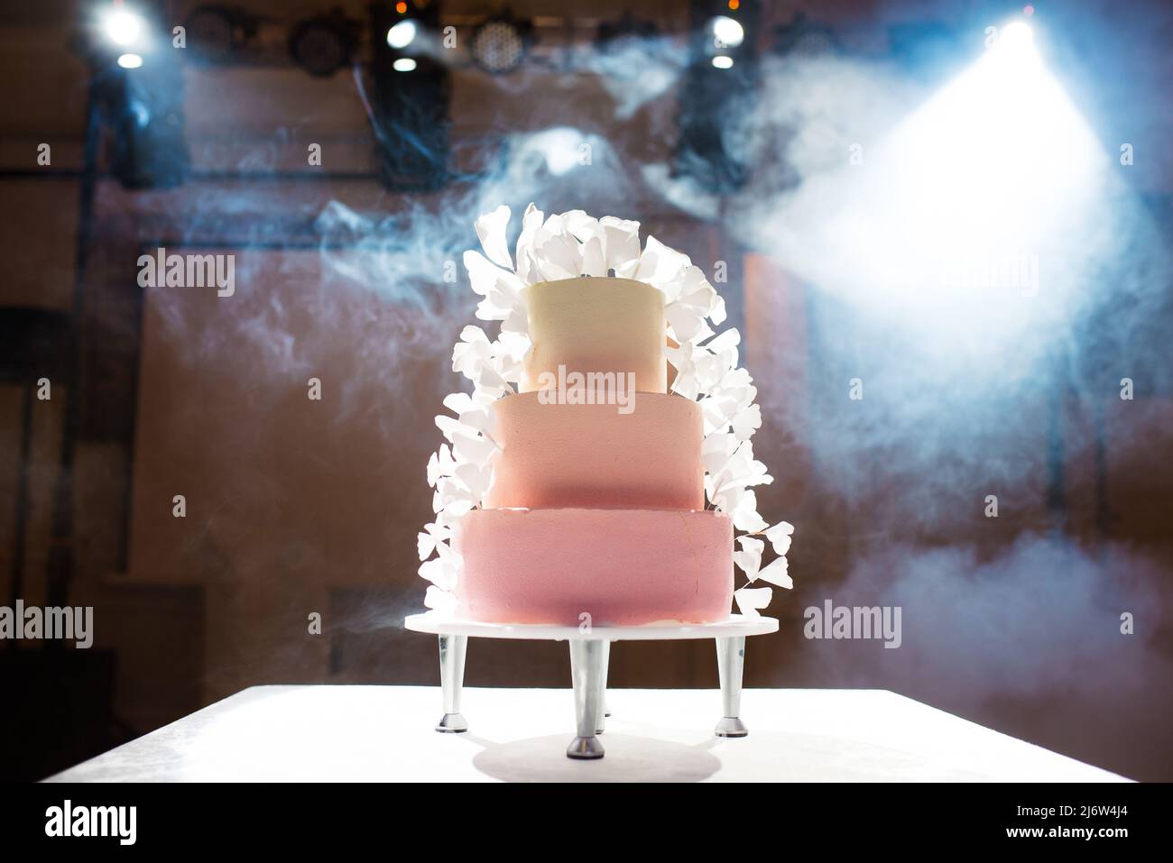 Beautiful birthday cake on the table from multiple tiers Stock Photo ...