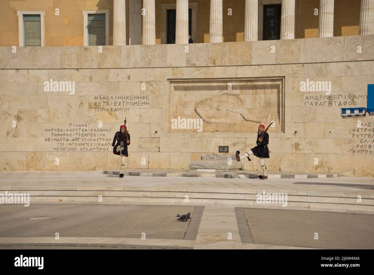 Tourists and visitors view the change of guard at Syntagma Square by the Old Royal Palace ...