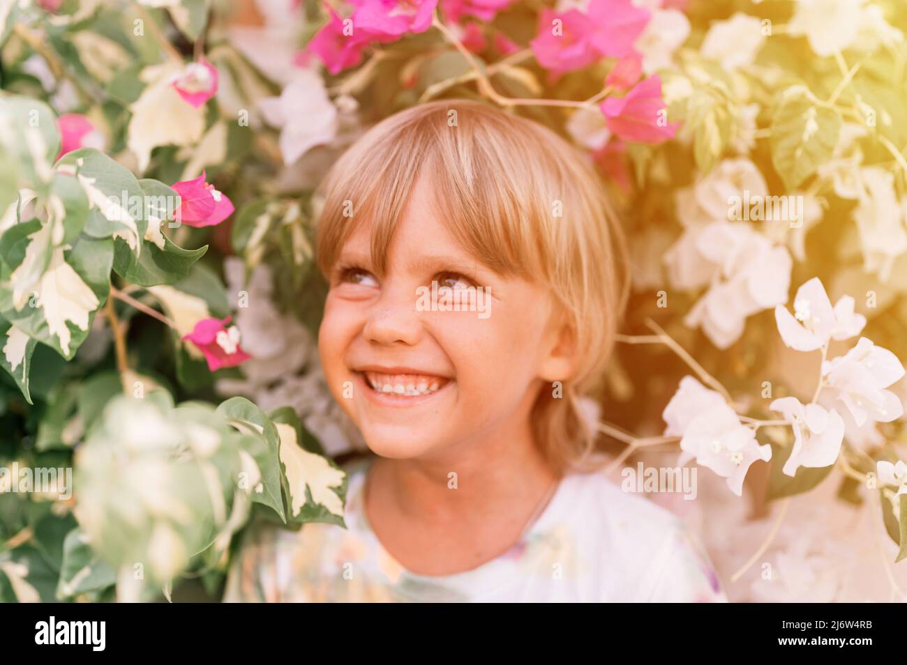 defocused blurred portrait of face candid little happy smiling five ...