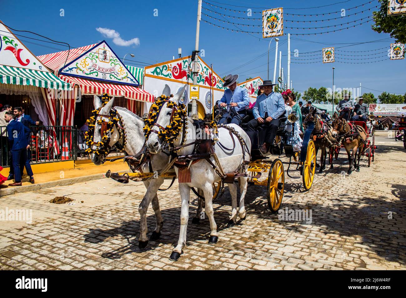 Seville, Spain - May 01, 2022 Sevillians dressed in the traditional ...