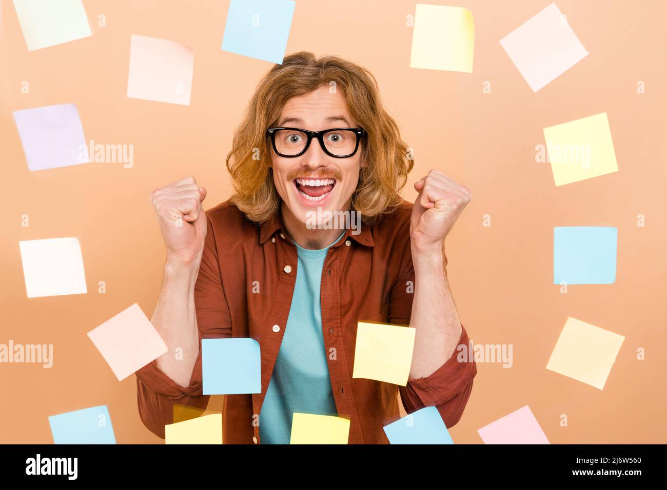 Portrait of attractive cheery red-haired guy memo wall celebrating ...