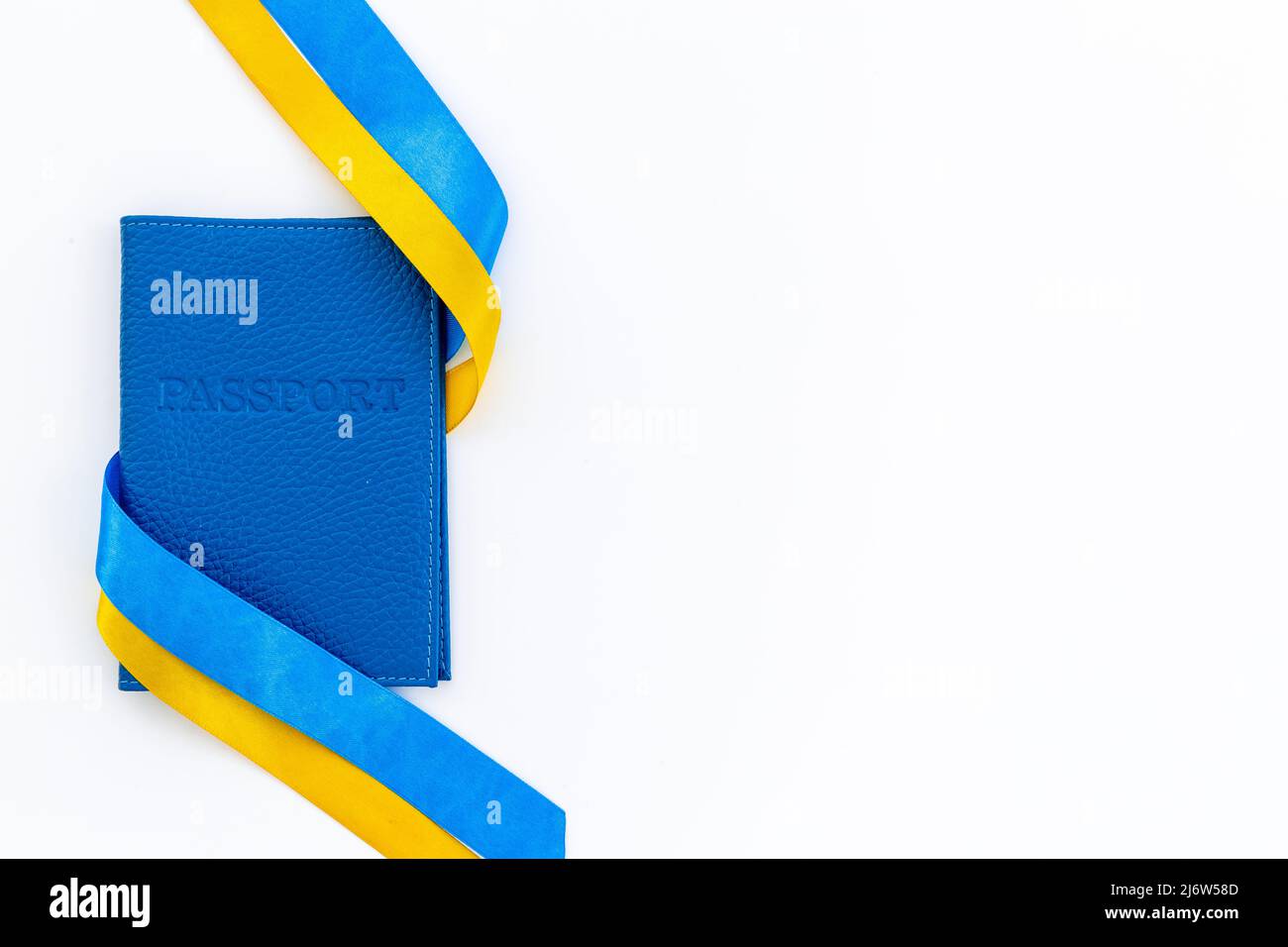 Yellow and blue ribbon with passport. Ukrainian immigration concept ...
