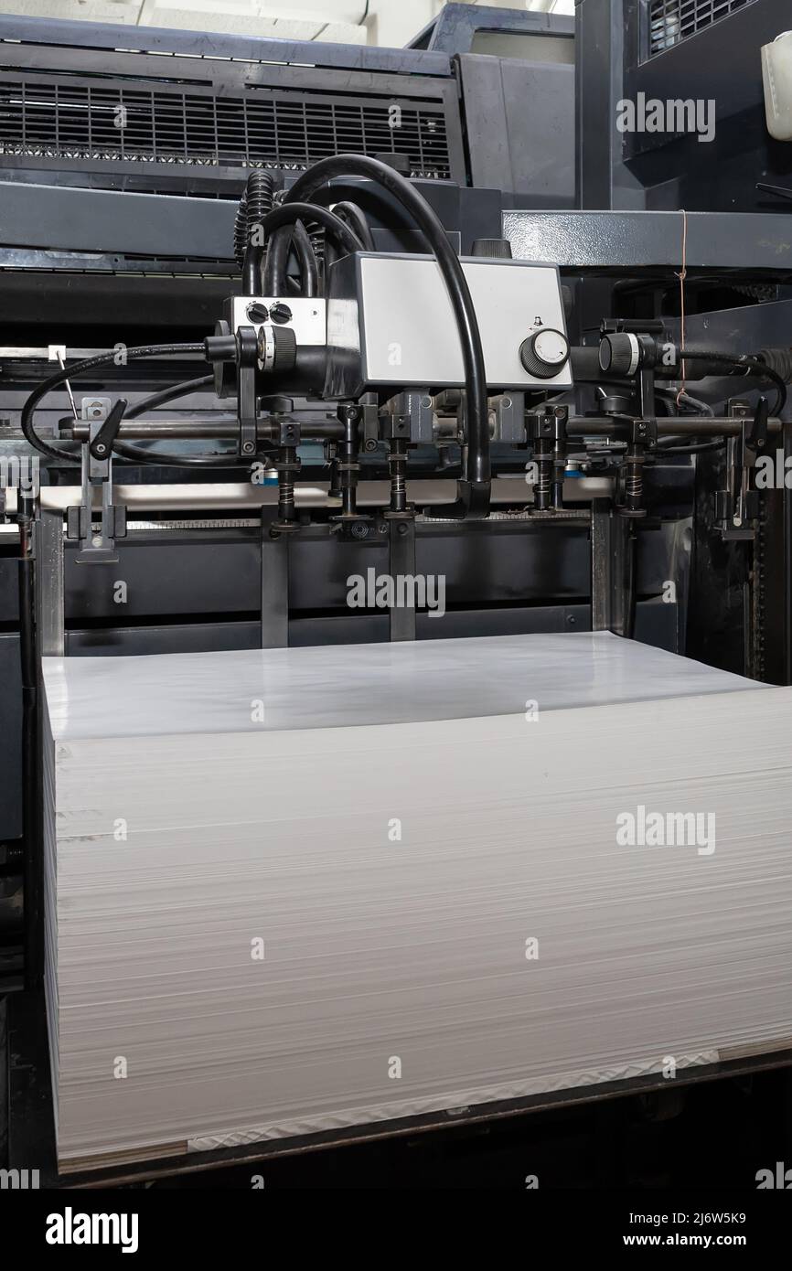 A stack of paper is loaded into a typewriter Stock Photo - Alamy