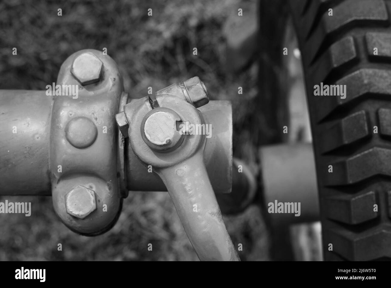 Vintage rusty farm tractor steering wheel mechanism in black and white ...