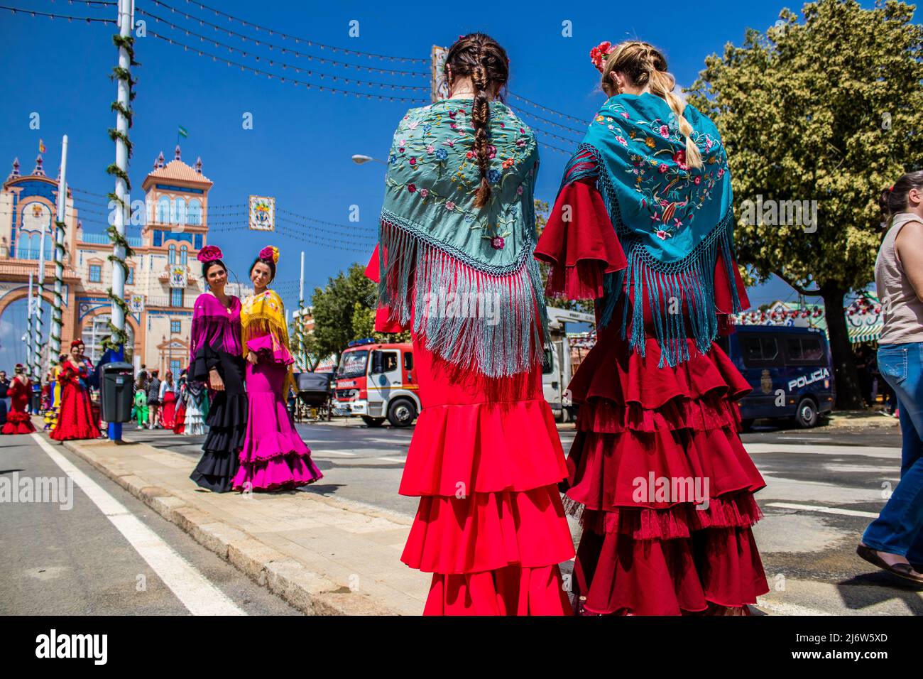 Seville, Spain - May 01, 2022 Sevillians dressed in the traditional ...