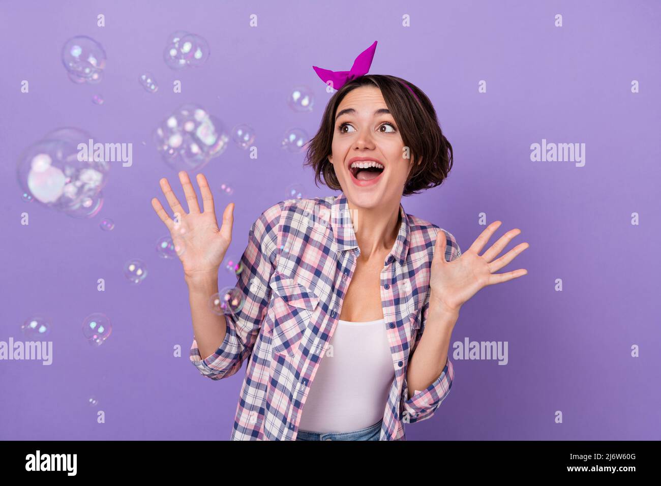 Photo of young cheerful girl excited look empty space reaction childish ...