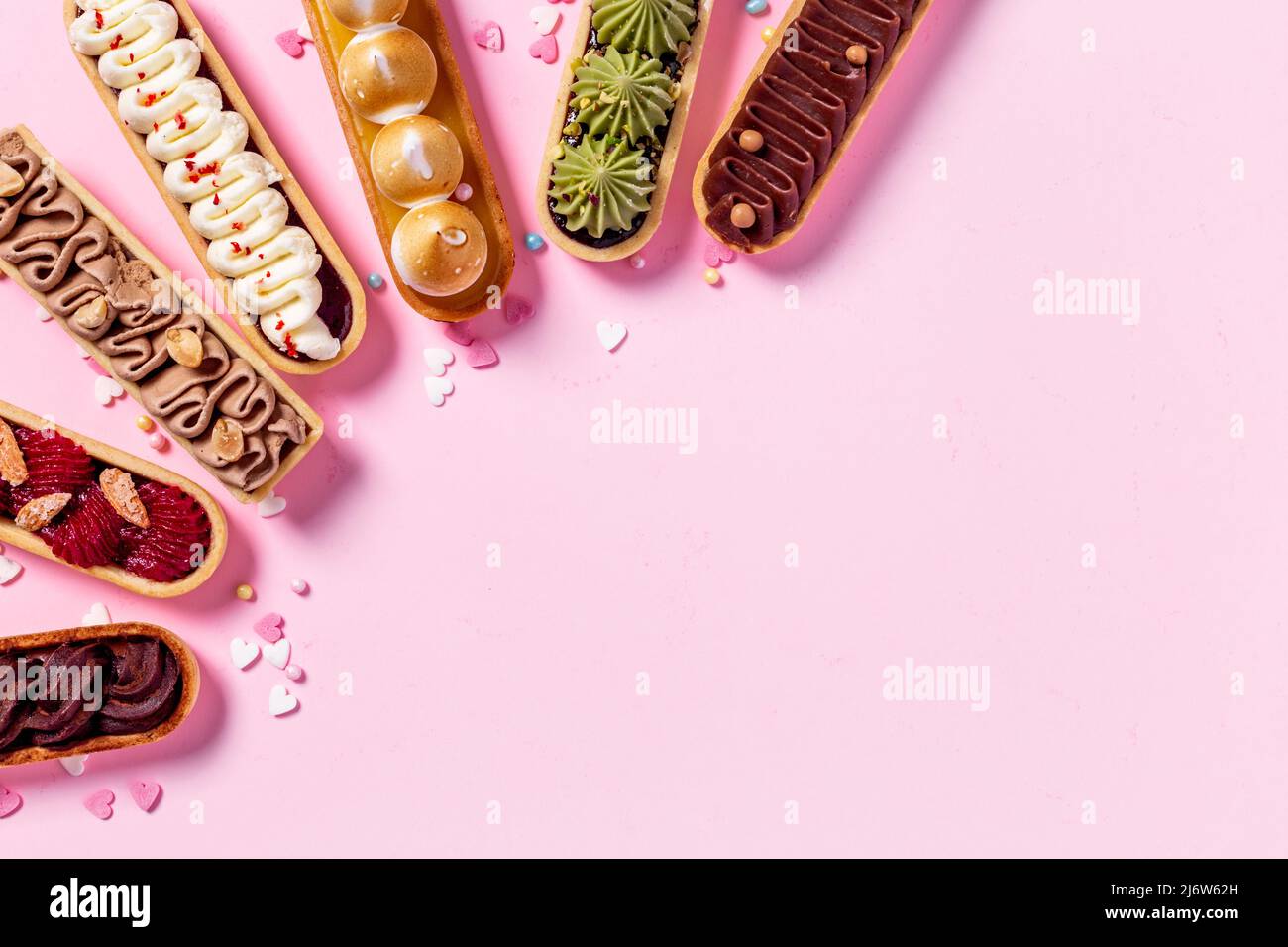 Top view of sweet bakery eclairs with color topping Stock Photo - Alamy