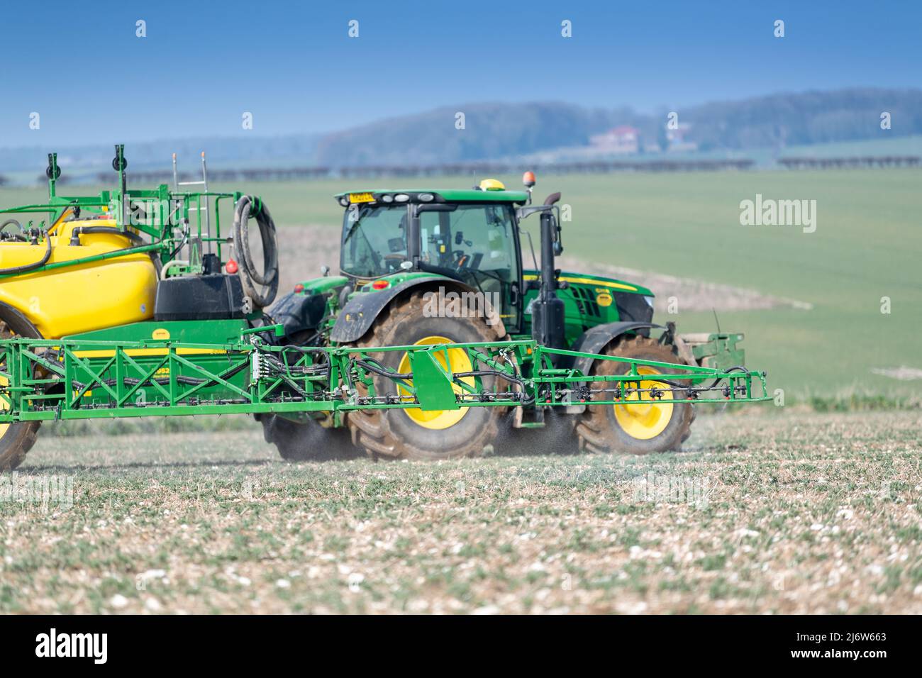 Spraying arable crop on the Yorkshire Wolds near York, using a John ...