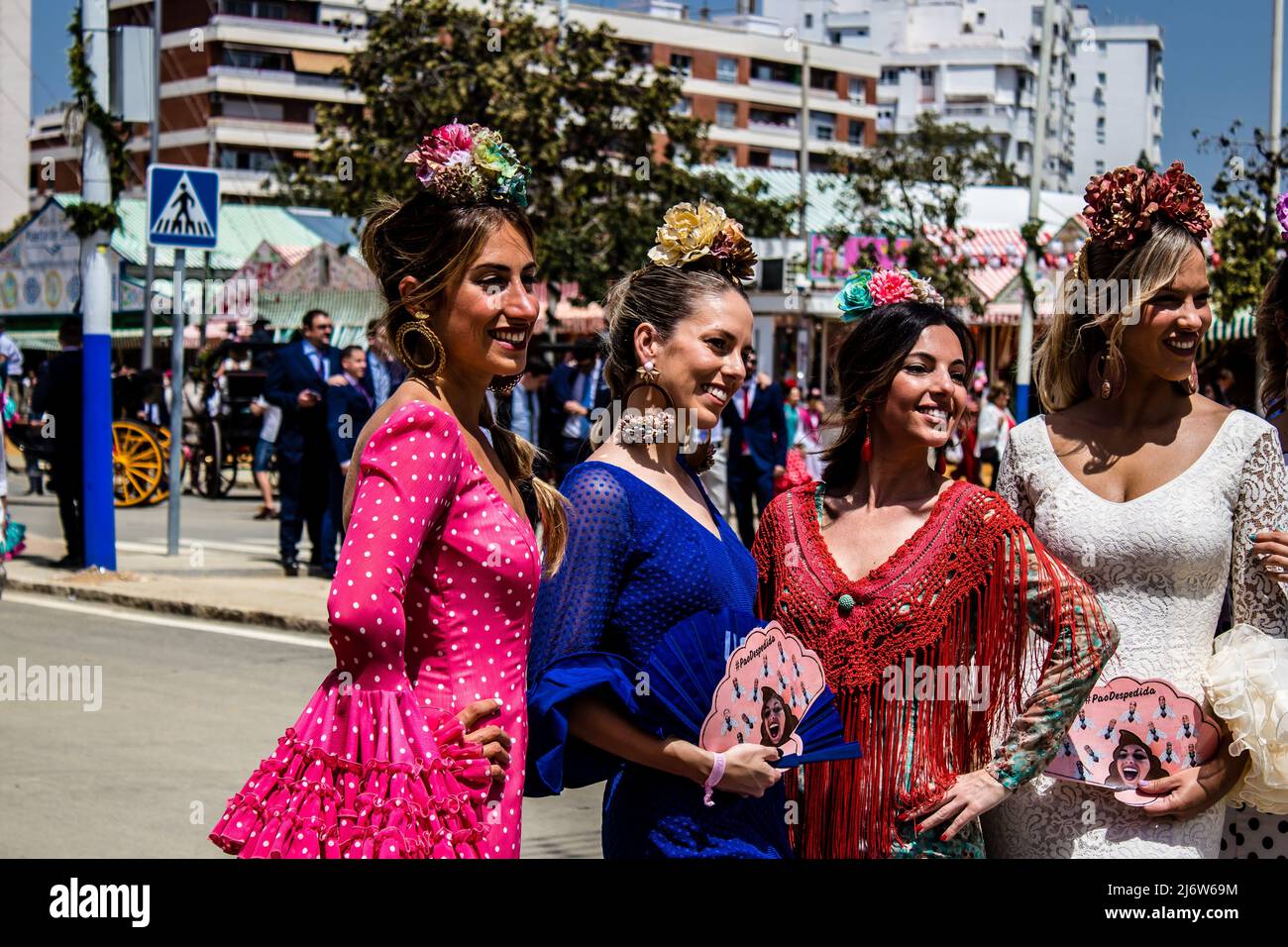 Seville, Spain - May 01, 2022 Sevillians dressed in traditional ...