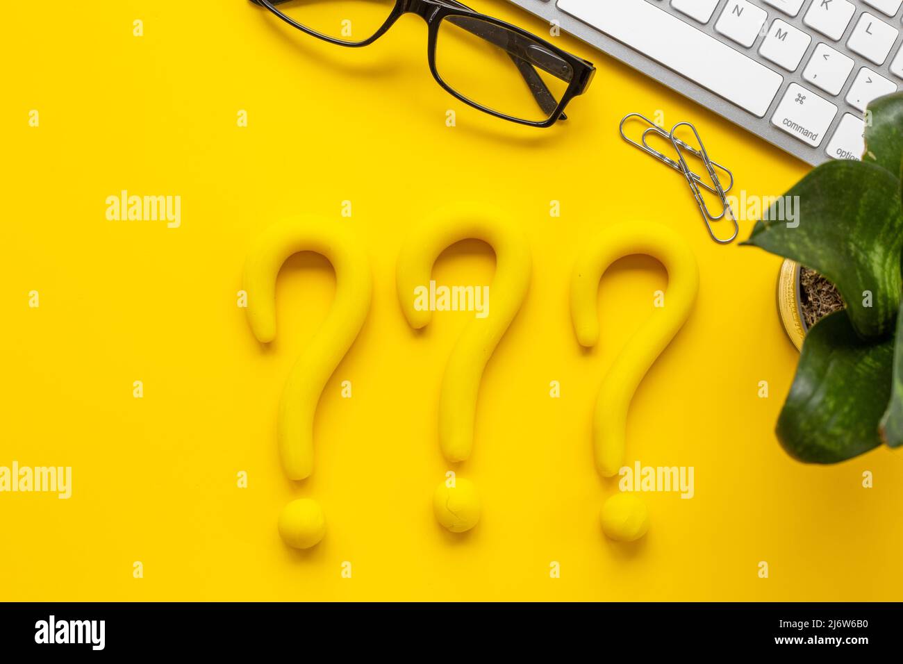 Question mark symbol on office desk. Solving problem or search solution ...