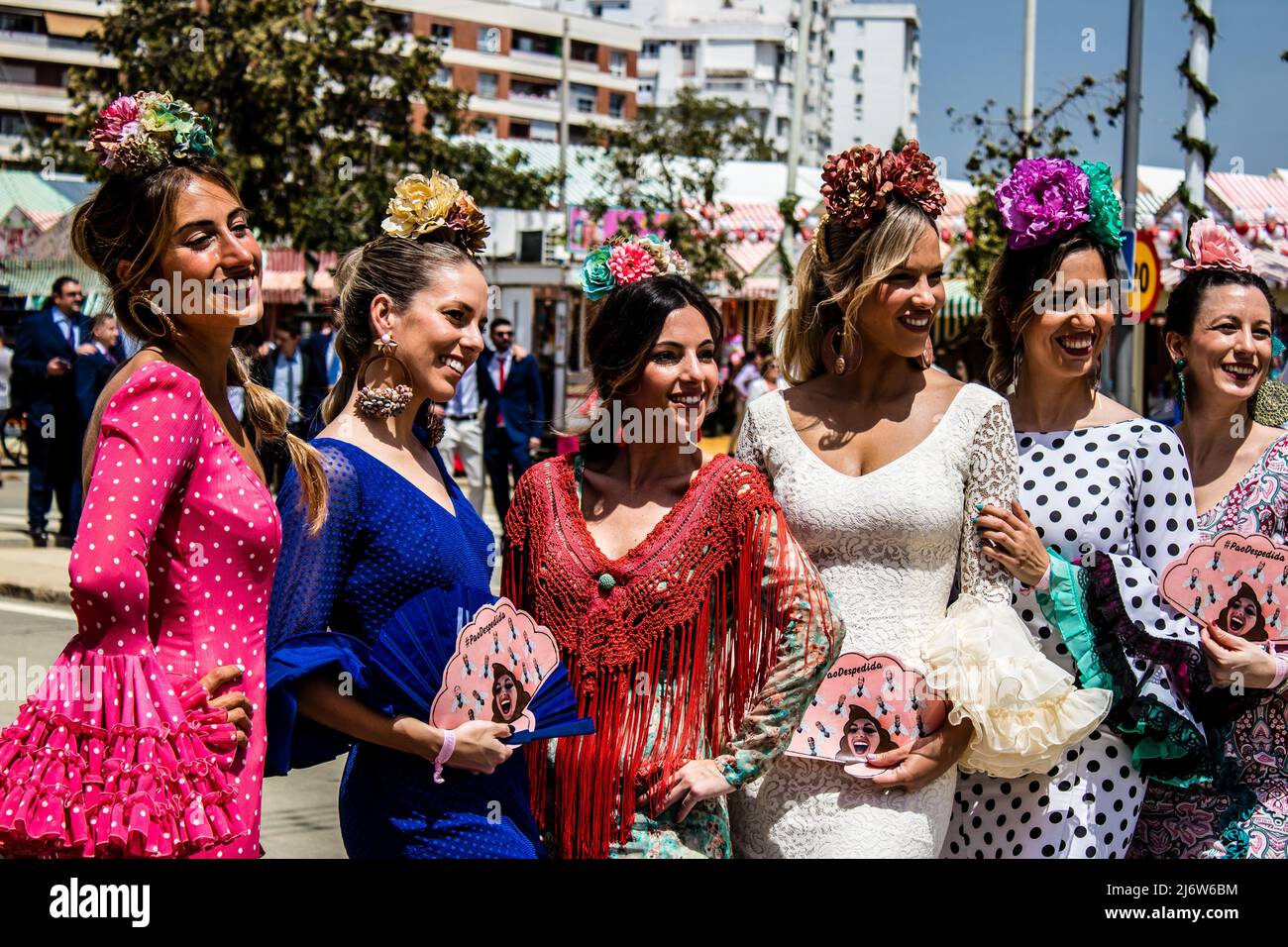 Seville, Spain - May 01, 2022 Sevillians dressed in traditional ...