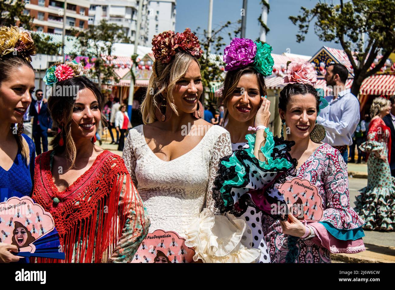Seville, Spain - May 01, 2022 Sevillians dressed in traditional ...