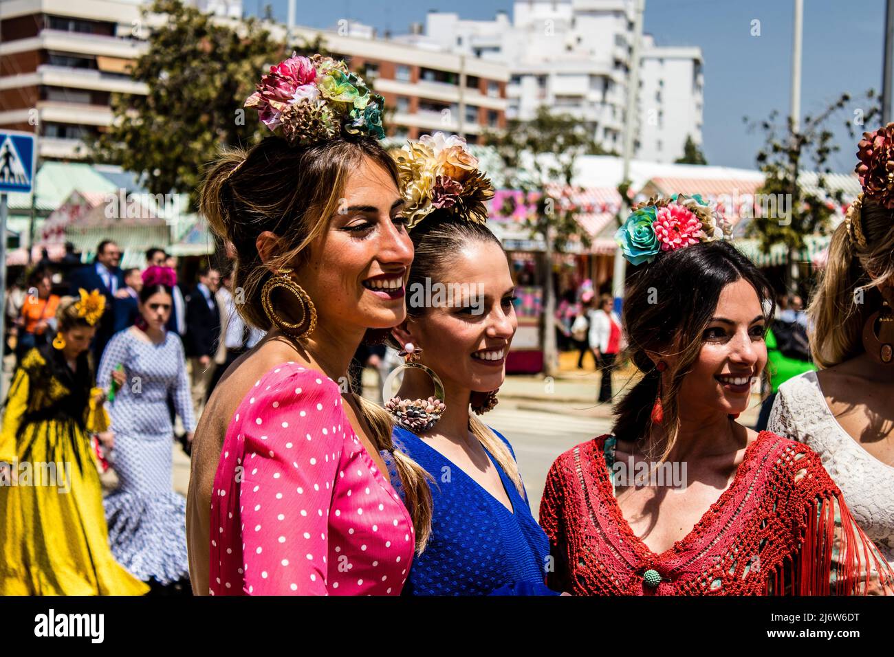 Seville, Spain - May 01, 2022 Sevillians dressed in traditional ...