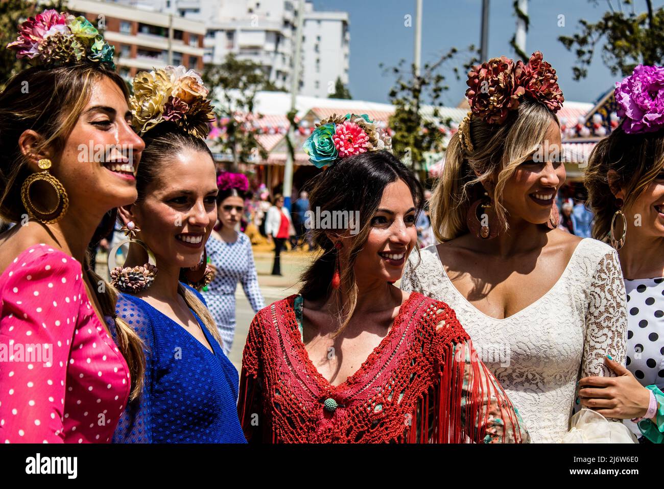 Seville, Spain - May 01, 2022 Sevillians dressed in traditional ...