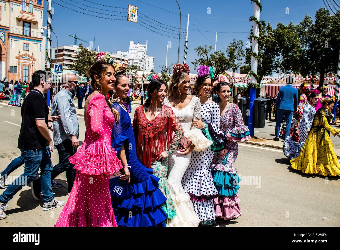 Seville, Spain - May 01, 2022 Sevillians dressed in traditional ...