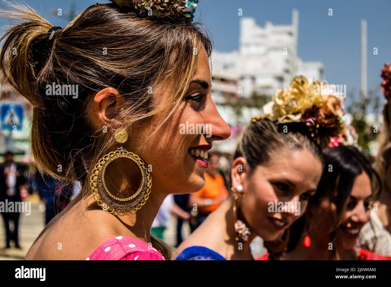 Seville, Spain - May 01, 2022 Sevillians dressed in traditional ...