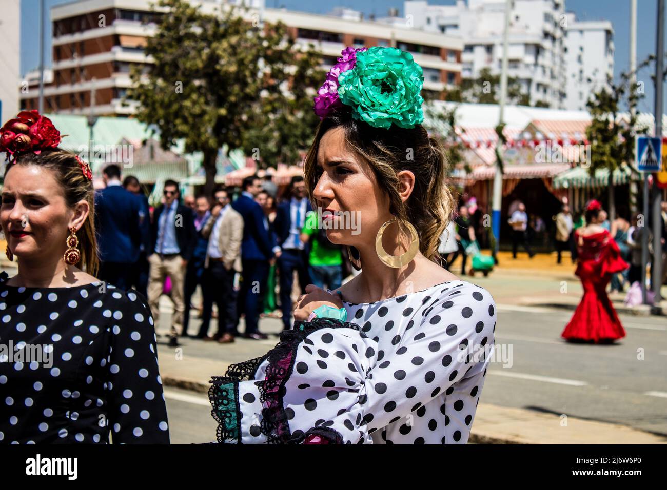 Seville, Spain - May 01, 2022 Sevillians dressed in traditional ...