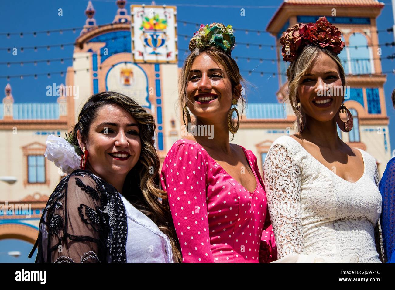 Seville, Spain - May 01, 2022 Sevillians dressed in traditional ...