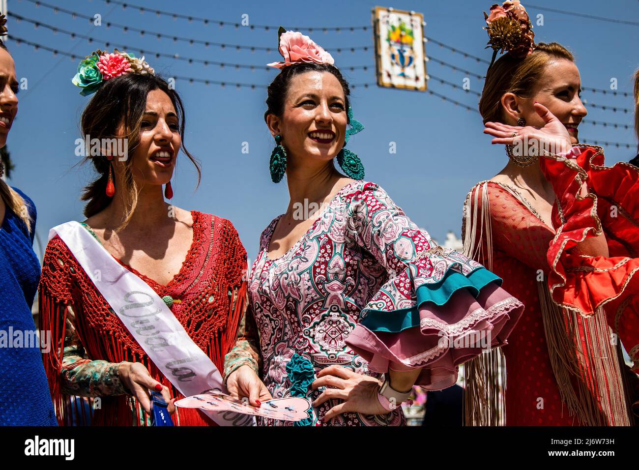 Seville, Spain - May 01, 2022 Sevillians dressed in traditional ...