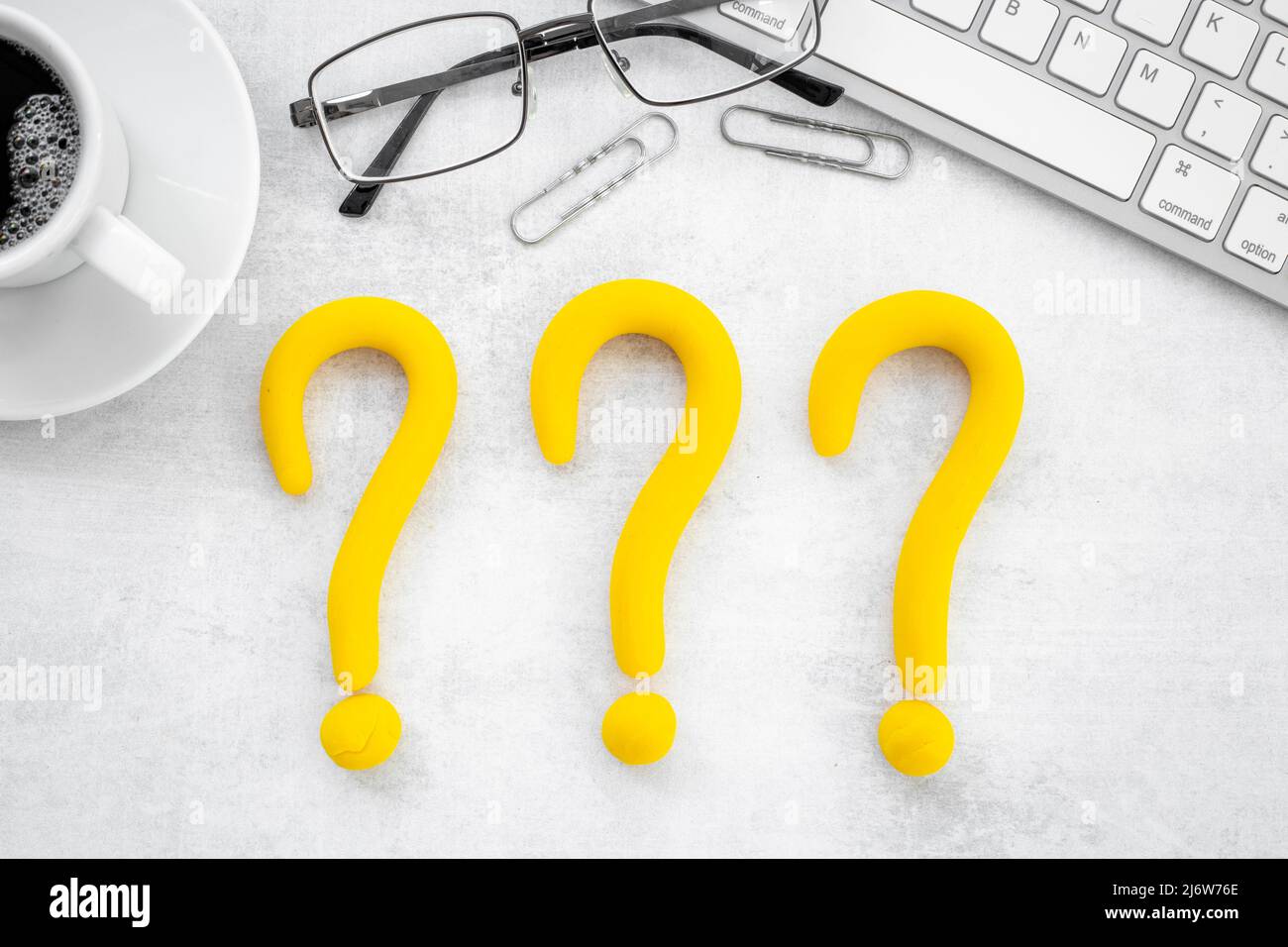 Question mark symbol on office desk. Solving problem or search solution ...