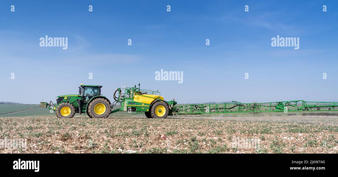 Spraying arable crop on the Yorkshire Wolds near York, using a John ...