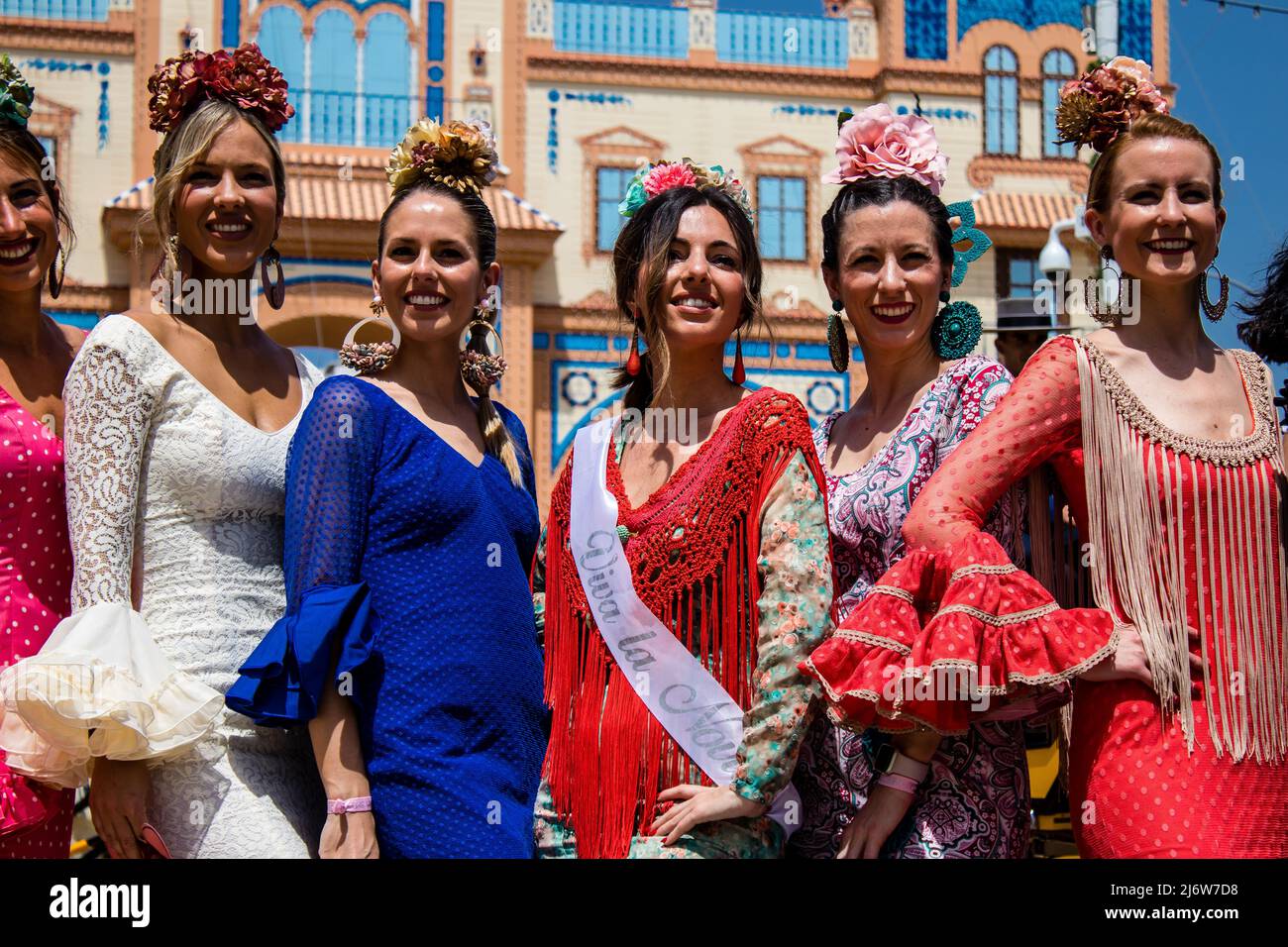 Seville, Spain - May 01, 2022 Sevillians dressed in traditional ...