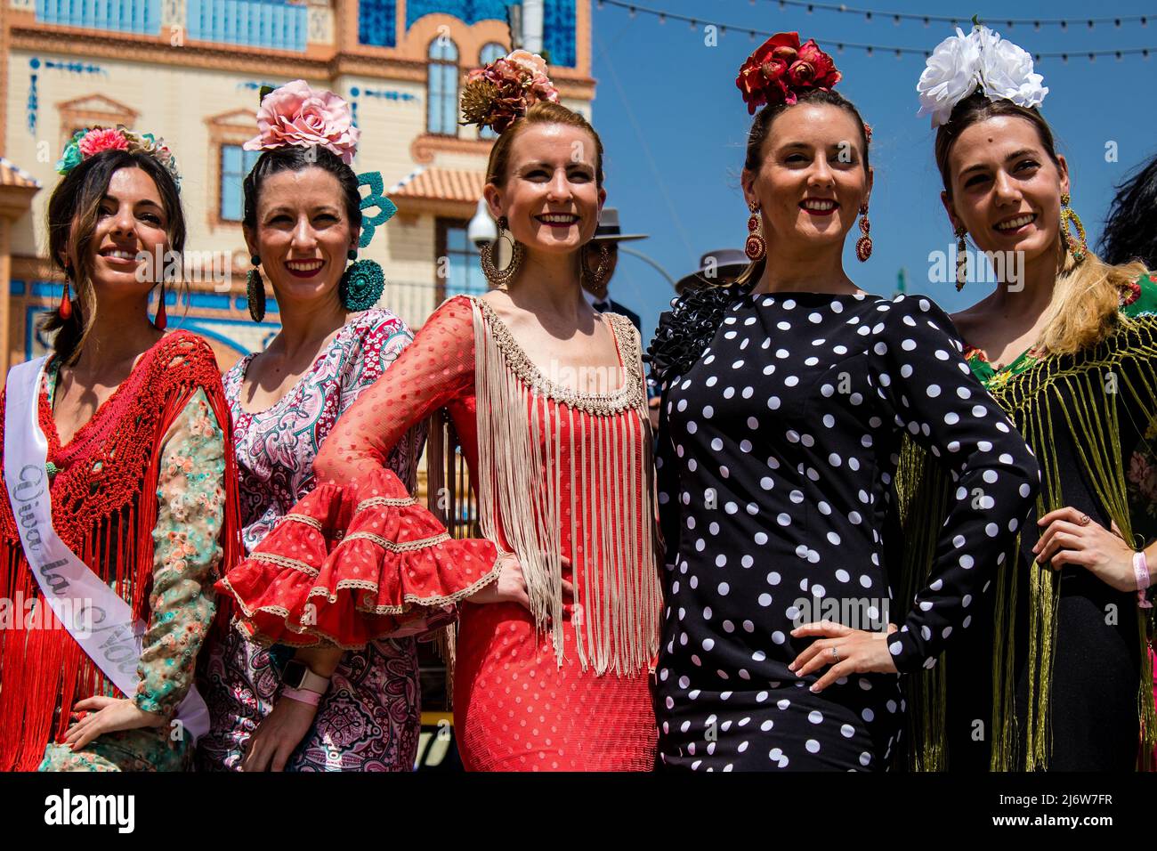 Seville, Spain - May 01, 2022 Sevillians dressed in traditional ...