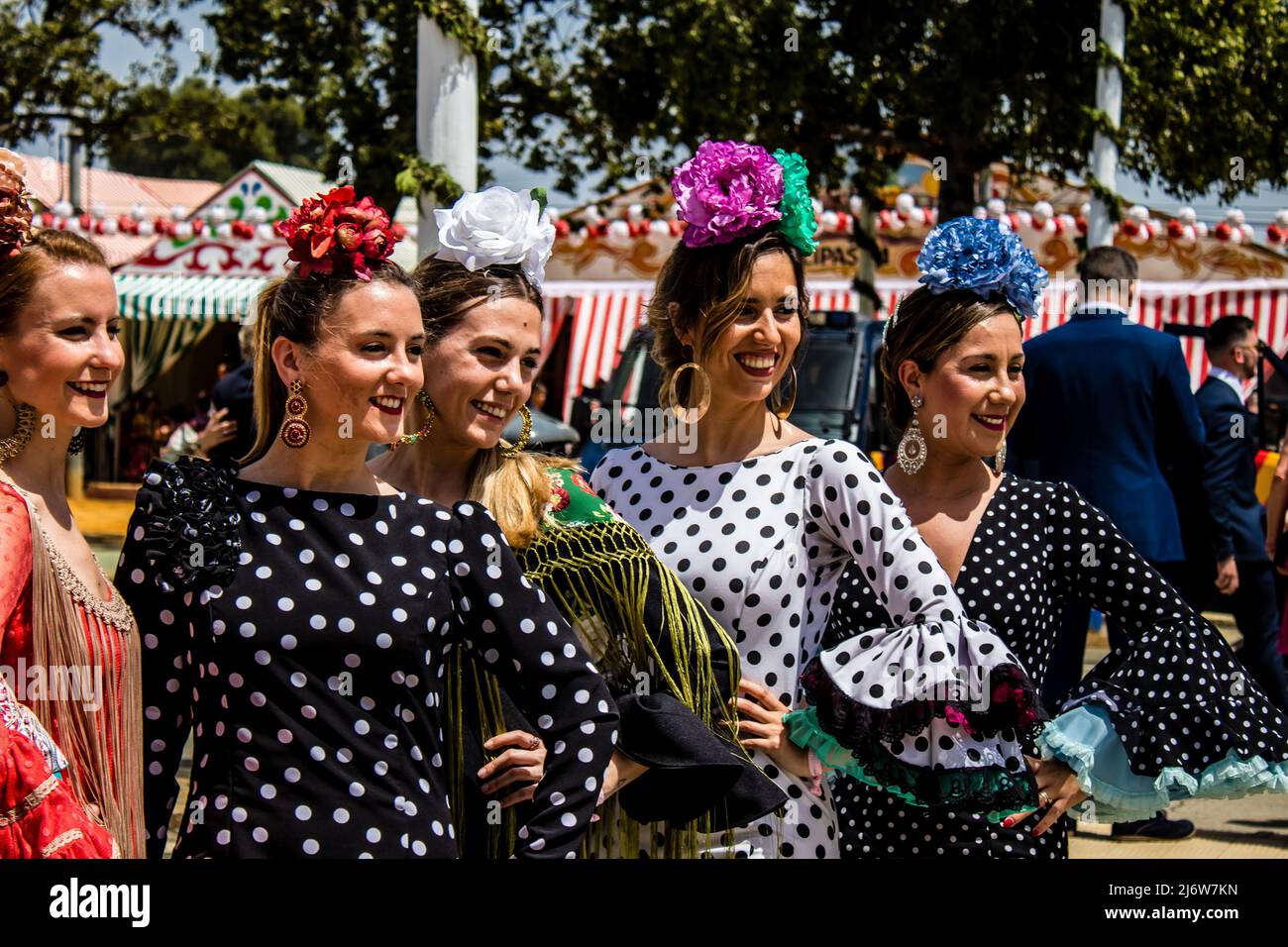 Seville, Spain - May 01, 2022 Sevillians dressed in traditional ...